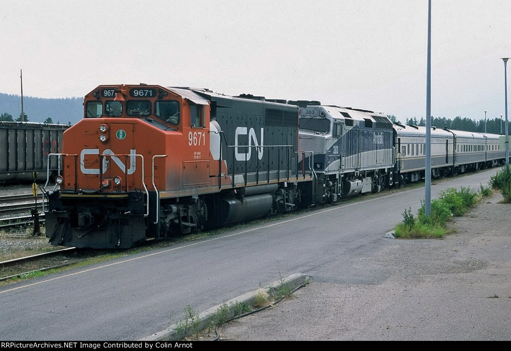 CN 9671 and Amtrak 383 wait in Jasper Station with the American Orient Express